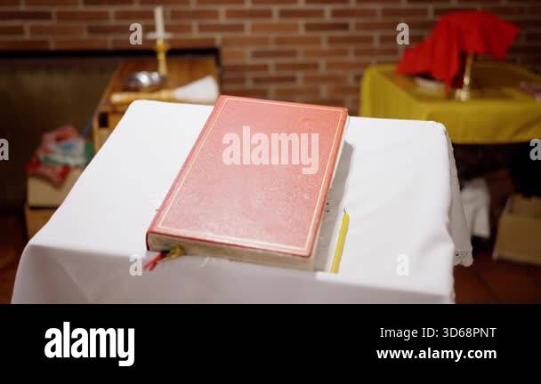 red lectionary book on altar cloth, leather cover with ribbon bookmark ...