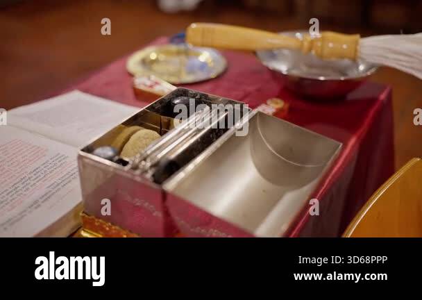altar table with liturgical tools, metal censer box, aspergillum brush ...