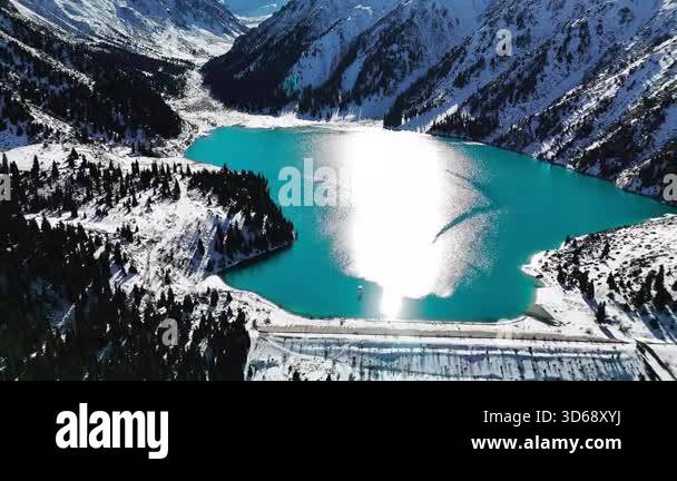 Aerial drone view of Big Almaty mountains lake landscape covered with ...
