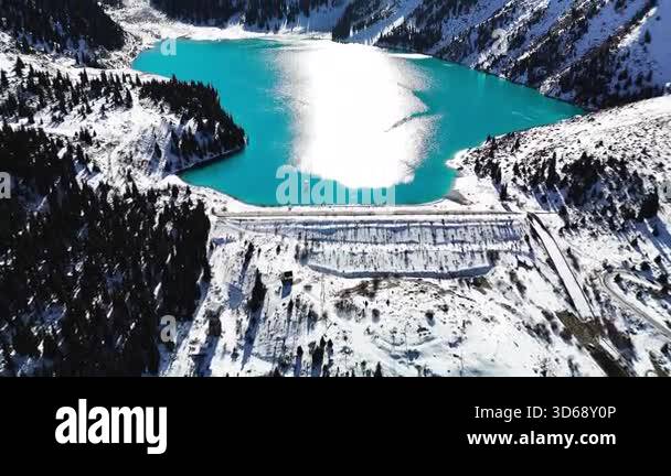 Aerial drone view of Big Almaty mountains lake landscape covered with ...