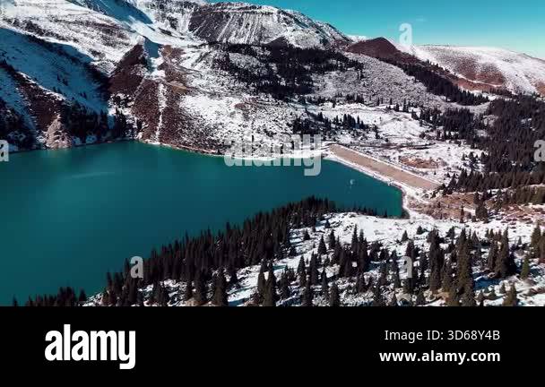 Aerial drone view of Big Almaty mountains lake landscape covered with ...