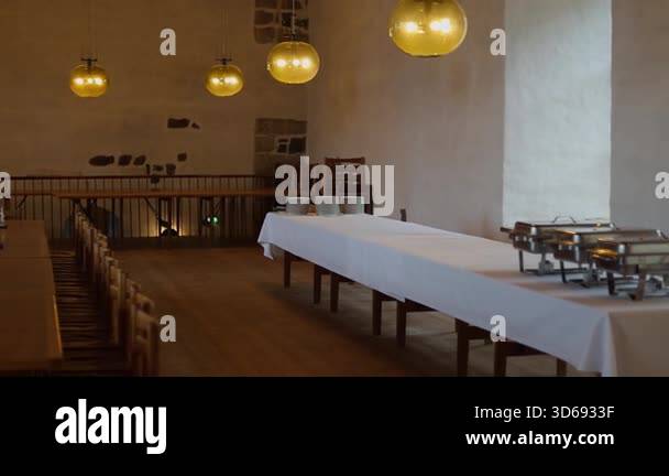 Interior of ancient castle rooms with stone walls, wooden furniture ...