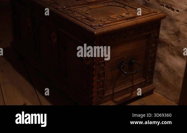 Dark stone prison inside a medieval castle, rusty bars, chains, and ...