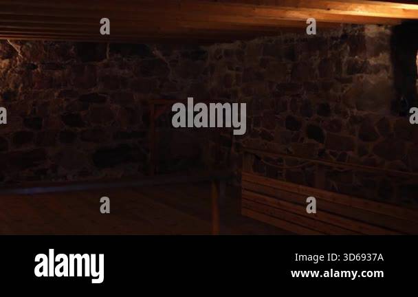 Interior of ancient castle rooms with stone walls, wooden furniture ...