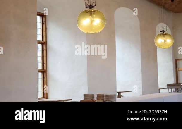 Interior of ancient castle rooms with stone walls, wooden furniture ...