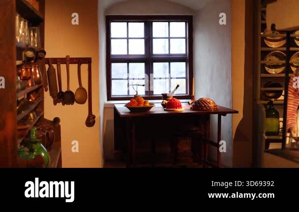 Interior of an old castle kitchen with medieval-style food setup on ...