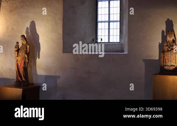 Interior of ancient castle rooms with stone walls, wooden furniture ...