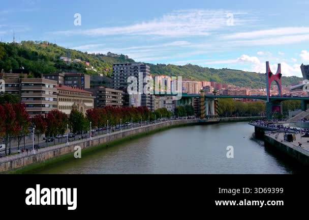 A stunning cityscape view of Bilbao, Spain, featuring the iconic ...