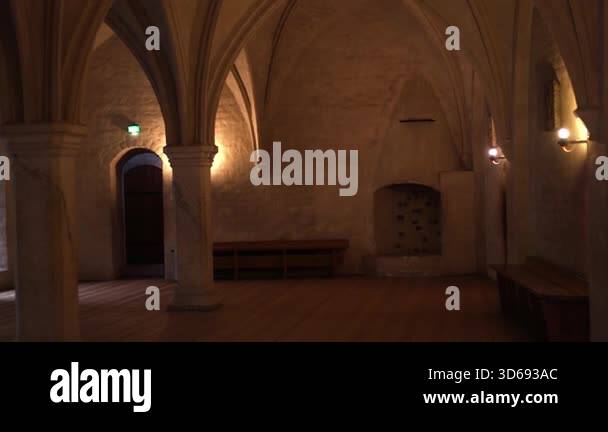 Interior of ancient castle rooms with stone walls, wooden furniture ...