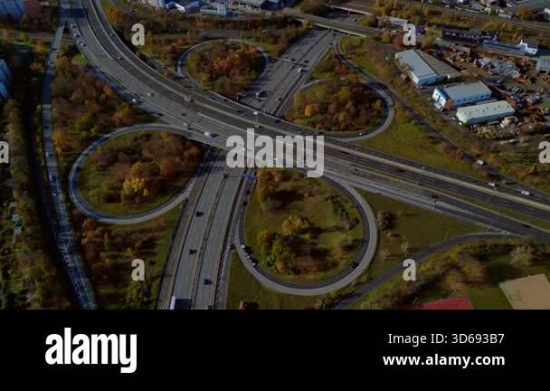 Complex highway interchange with cars traversing roads in Berlin. Birds ...