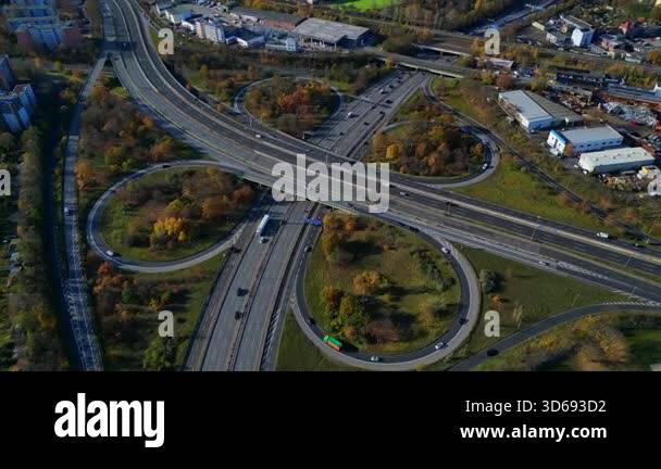 Complex highway interchange with cars traversing roads in Berlin. Birds ...