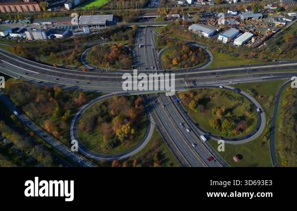 Complex highway interchange with cars traversing roads in Berlin. Birds ...