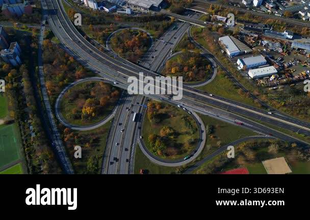 Complex highway interchange with cars traversing roads in an aerial ...