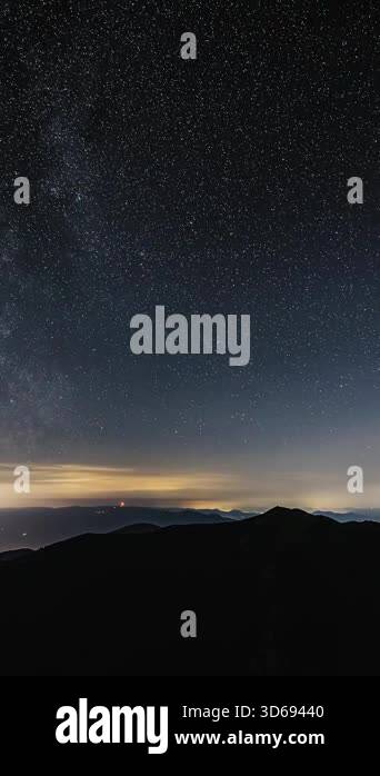 Vertical time lapse capturing stars and the Milky Way galaxy gracefully ...