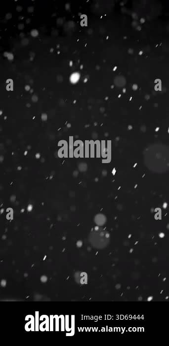 Vertical background of gently falling snowflakes creating a calm winter ...