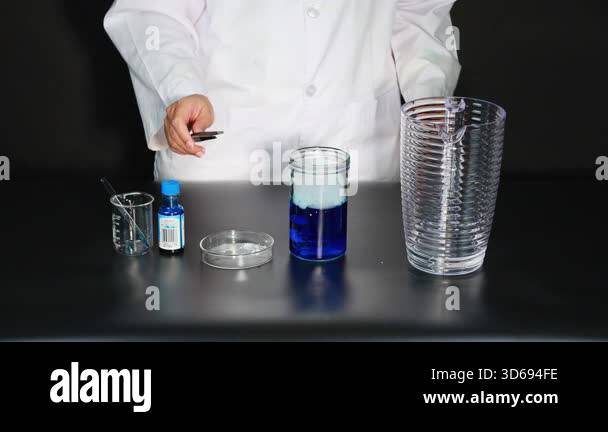 Experiment demonstrating dry ice reaction in beaker Stock Video Footage ...