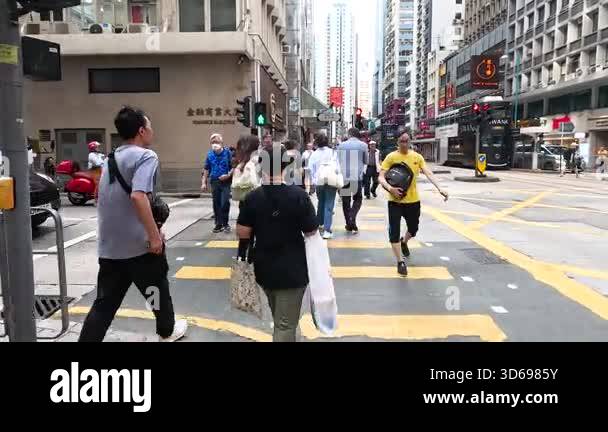 People walking and crossing at a city intersection Stock Video Footage ...