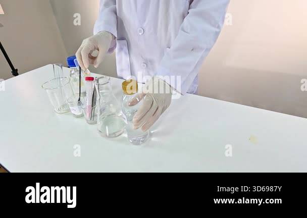 Scientist conducts a bromothymol blue experiment, showcasing color ...