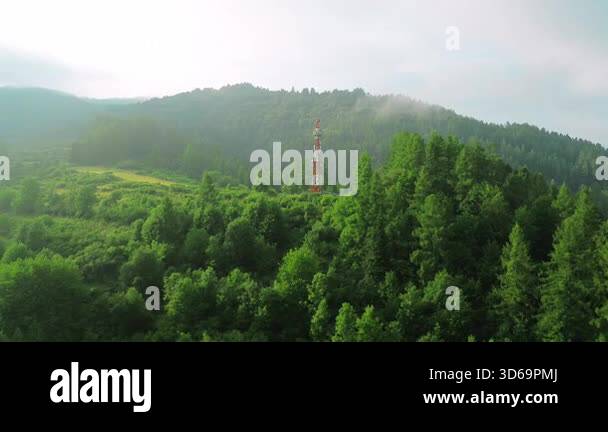 5G cell tower in mountain forest landscape Stock Video Footage - Alamy