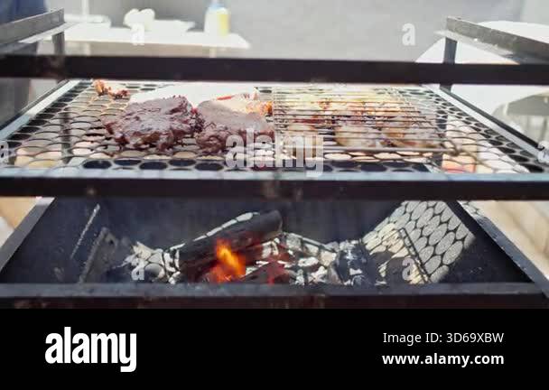 Closeup Of Barbecue Grill With Meat Cooking Over Charcoal Flame, Steaks ...