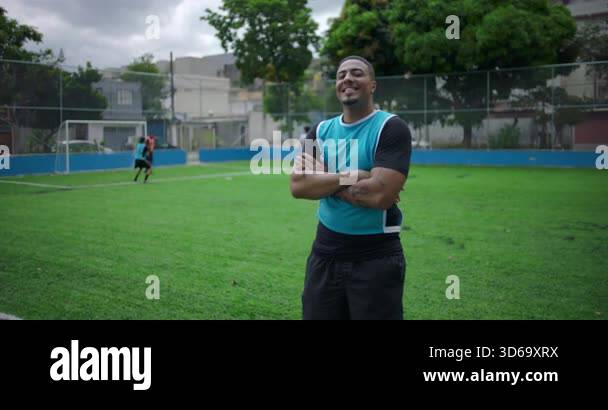 Latin Hispanic man of African descent smiling confidently on soccer ...