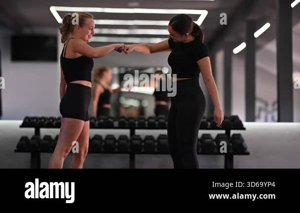 Two women discuss workout techniques and share tips for beginners in a ...
