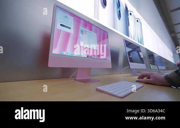 October 2, 2025. Munich, Germany. Male client exploring Apple Store ...