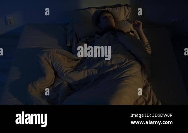 Angry sleepless man knocking on wall to stop loud neighbors ...