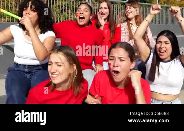 Group of excited multiracial female sports fans sitting together on ...
