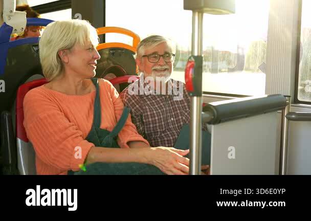 Lovely senior couple chatting and enjoying their journey together while ...