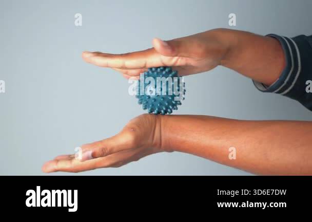 Relaxing hand exercises using a textured ball to relieve tension Stock ...