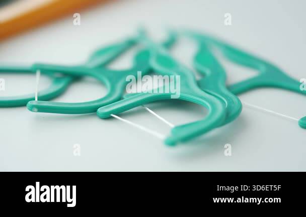 Learn how to use dental floss picks for better oral care Stock Video ...