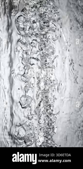Super slow motion of impact hit of splashing water, close-up. Filmed on ...
