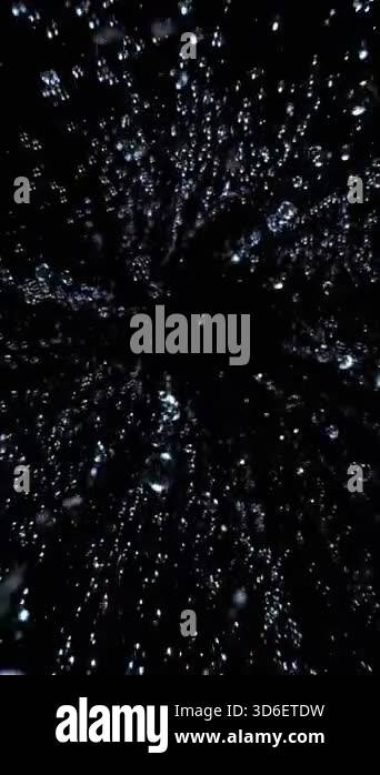 Super slow motion of water drops splashing from shower. Special wide ...