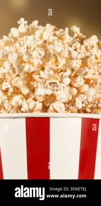 Super Slow Motion of Exploding popcorn from Bucket. Studio Shot of ...