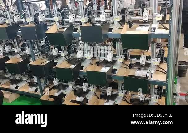 Kyiv, Ukraine, May 25, 2025: Many 3D printers printing an object. 3D ...