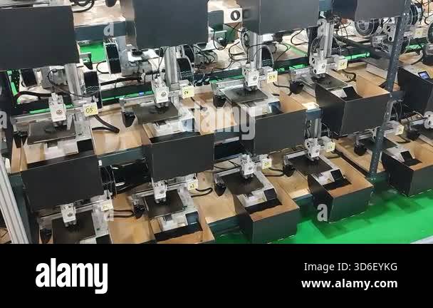 Many 3D printers printing an object. 3D printers simultaneously ...