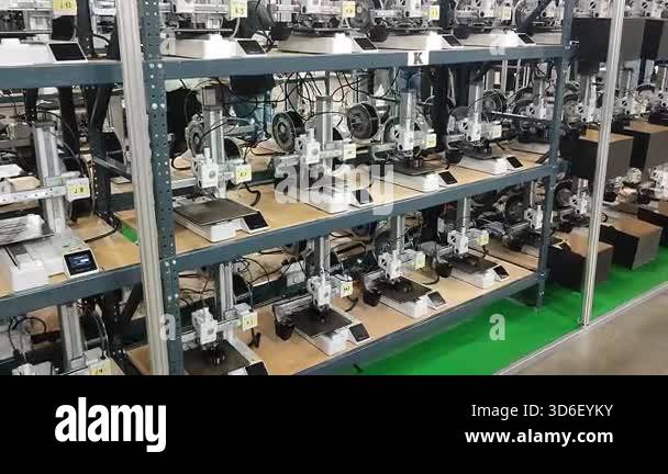 Kyiv, Ukraine, May 25, 2025: Many 3D printers printing an object. 3D ...