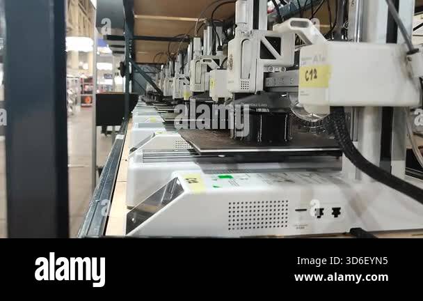 Kyiv, Ukraine, May 25, 2025: Many 3D printers printing an object. 3D ...