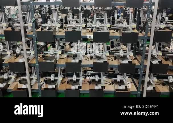 Kyiv, Ukraine, May 25, 2025: Many 3D printers printing an object. 3D ...
