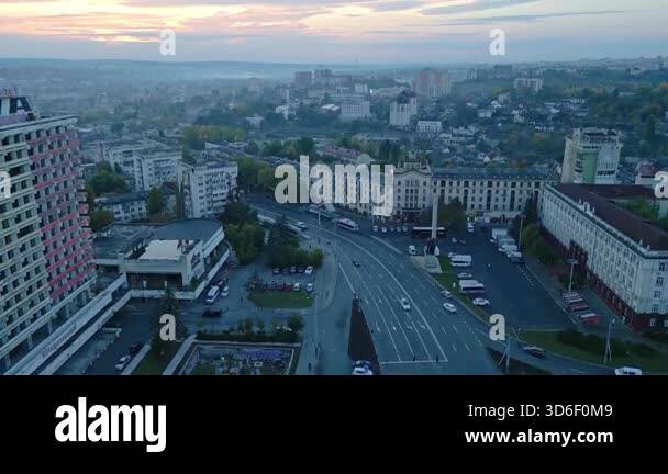 Aerial drone view of the city skyline at sunrise, showing streets ...