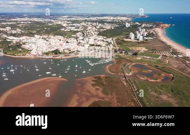 Alvor aerial view drone aerial marina full of anchored yachts and busy ...
