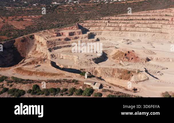 aerial bench levels close-up reveal spoil piles, terraced cut lines ...