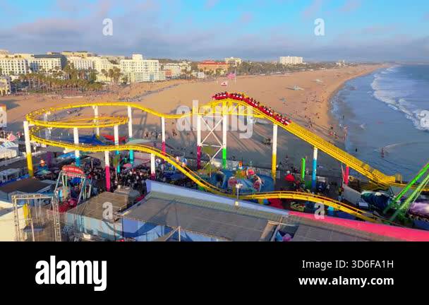 Aerial drone view of the bright yellow roller coaster at Pacific Park ...