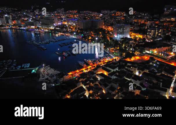 Tourist night city with colored electric lights and beaches against the ...