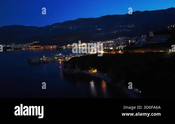 Tourist night city with colored electric lights and beaches against the ...