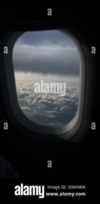 Skyward view with clouds, cinematic scene showing aircraft window ...
