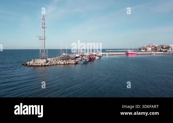 A small sea fishing port with boats in the calm deep cool Black Sea ...