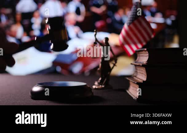 Closeup of judge hand striking gavel during courtroom trial. Wooden ...
