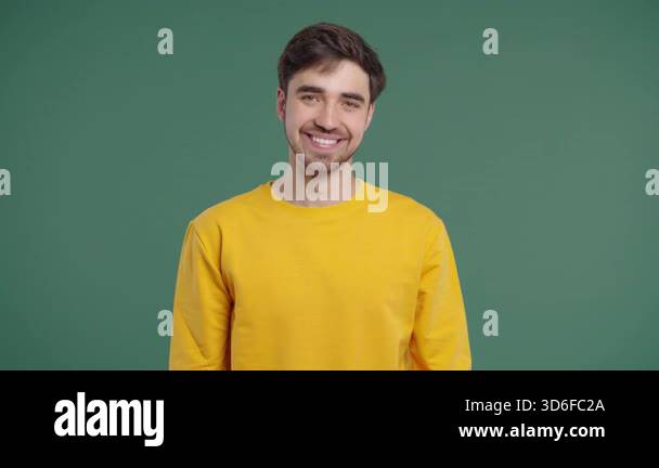 Confident smiling man nods head to show approval and agreement ...